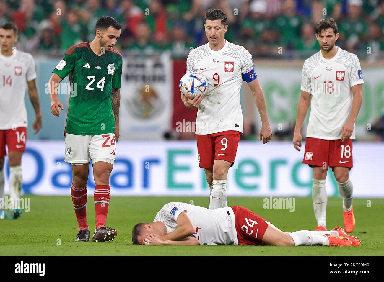 DOHA, QATAR - NOVEMBER 22: Luis Chavez of Mexico, Robert Lewandowski of ...