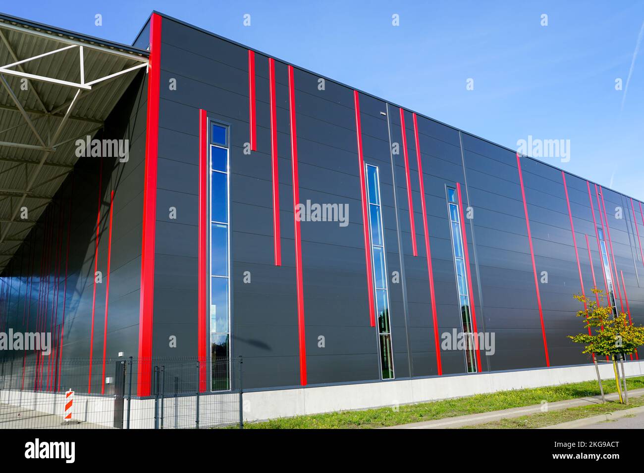 Modern design colorful sandwich panels facade with red vertical stripes ...
