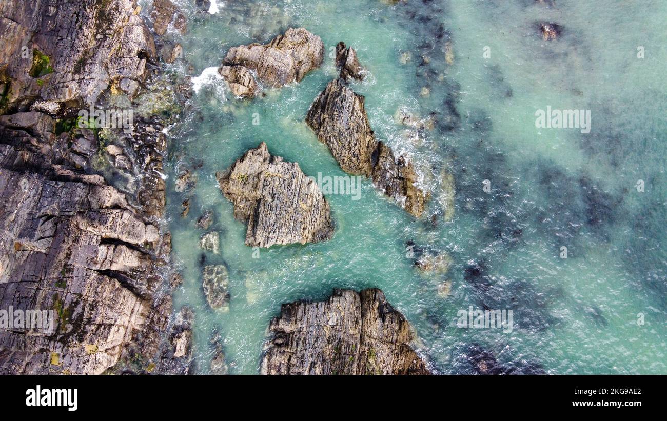 A lot of boulders in the sea. Coastal cliffs of the North Atlantic ...