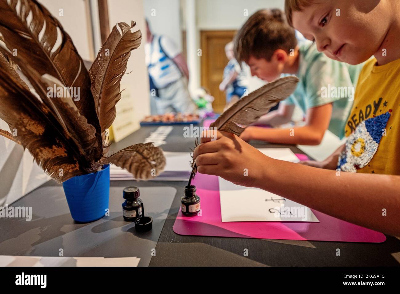Boy writing with pen and ink hi-res stock photography and images - Alamy