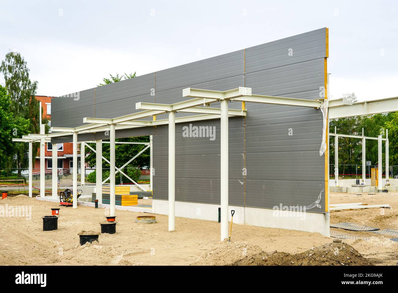 Unfinished white prefabricated steel construction frame of a new modern ...