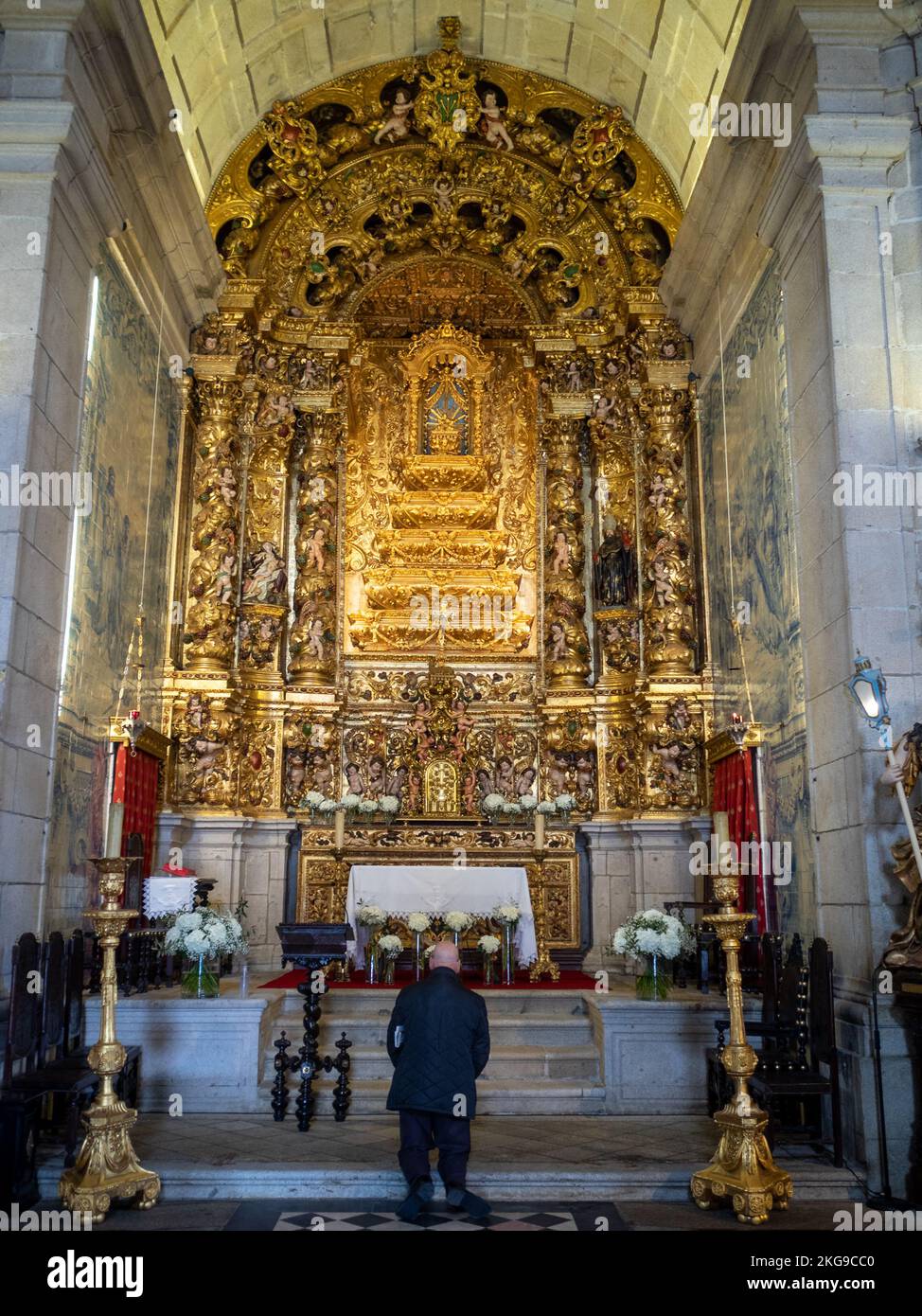 Praying in front of the high altar of the Igreja do Bom Jesus da Cruz ...