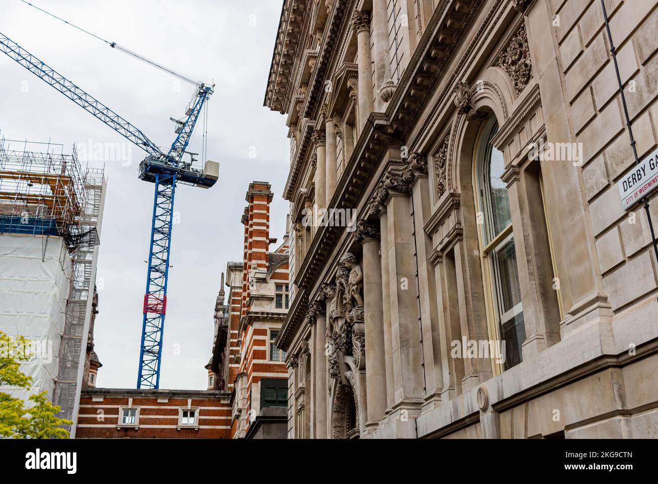 The exterior of an historic building with construction cranes in the ...