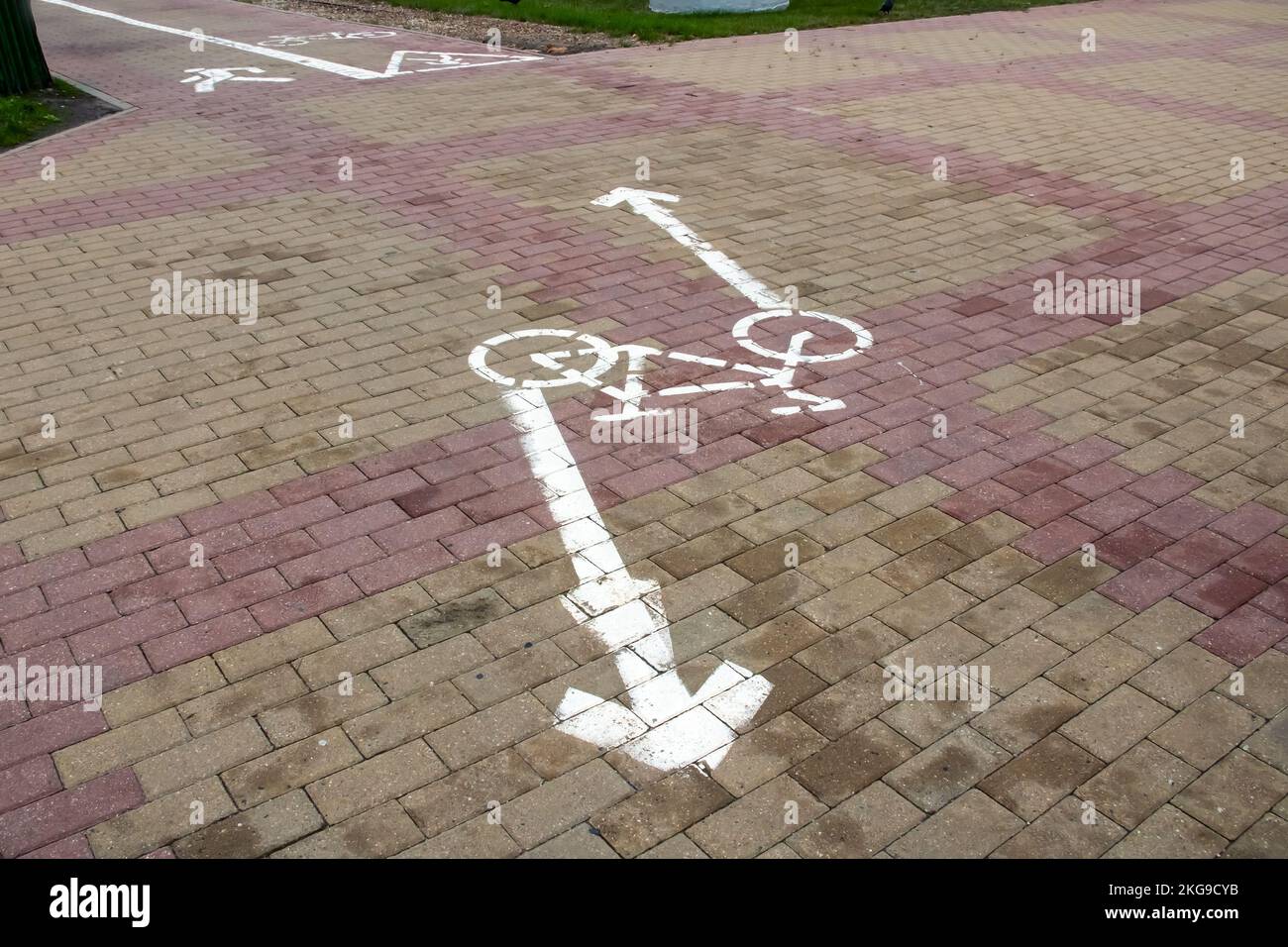 Bicycle path sign on paving slabs close up Stock Photo - Alamy