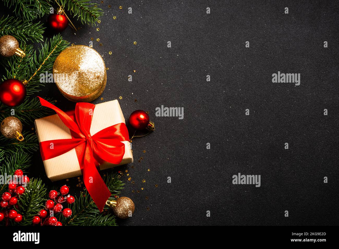 Christmas flat lay background. Present box, candle, fir tree and ...