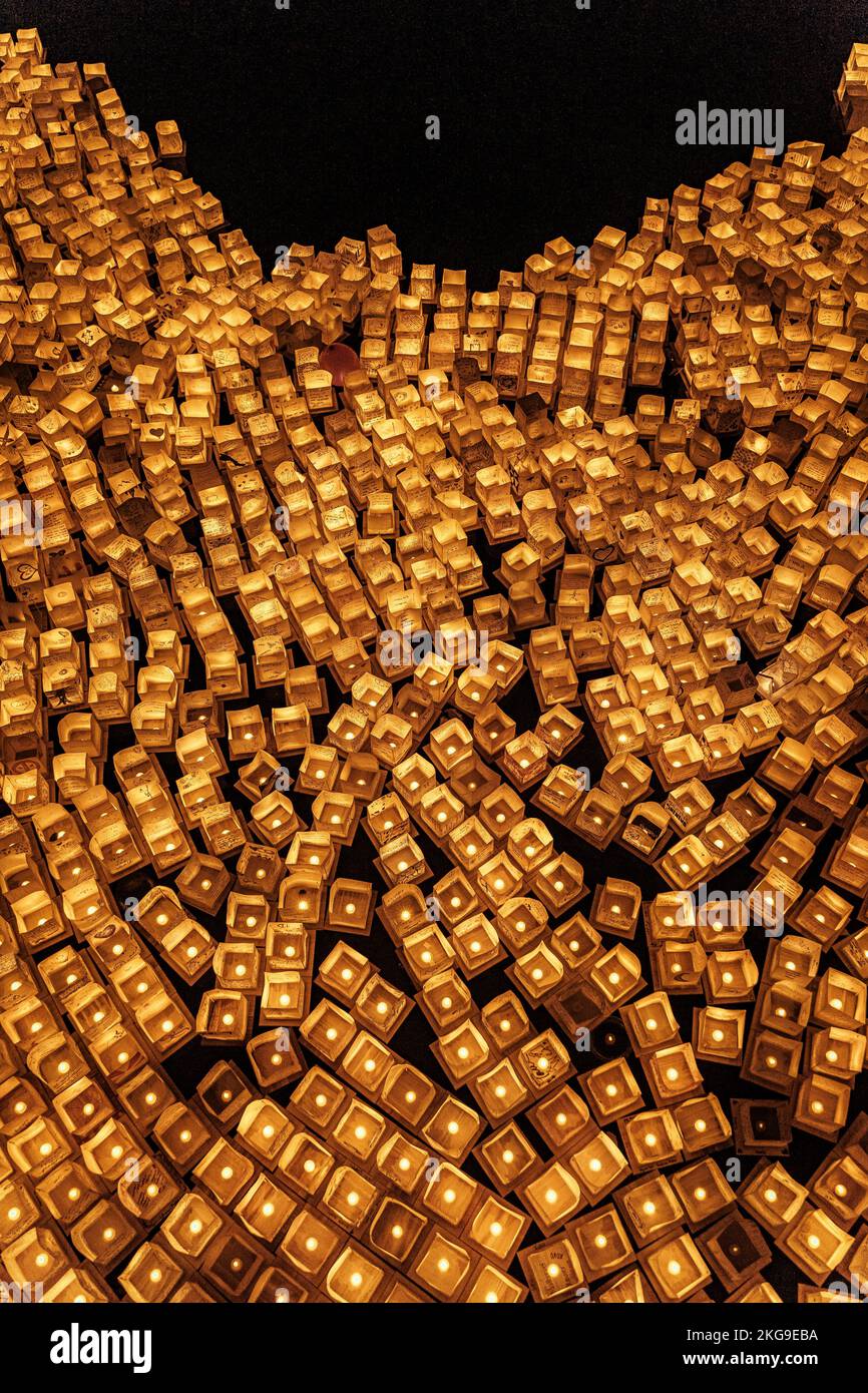 A high angle vertical image of a lot of lanterns floating on water at ...