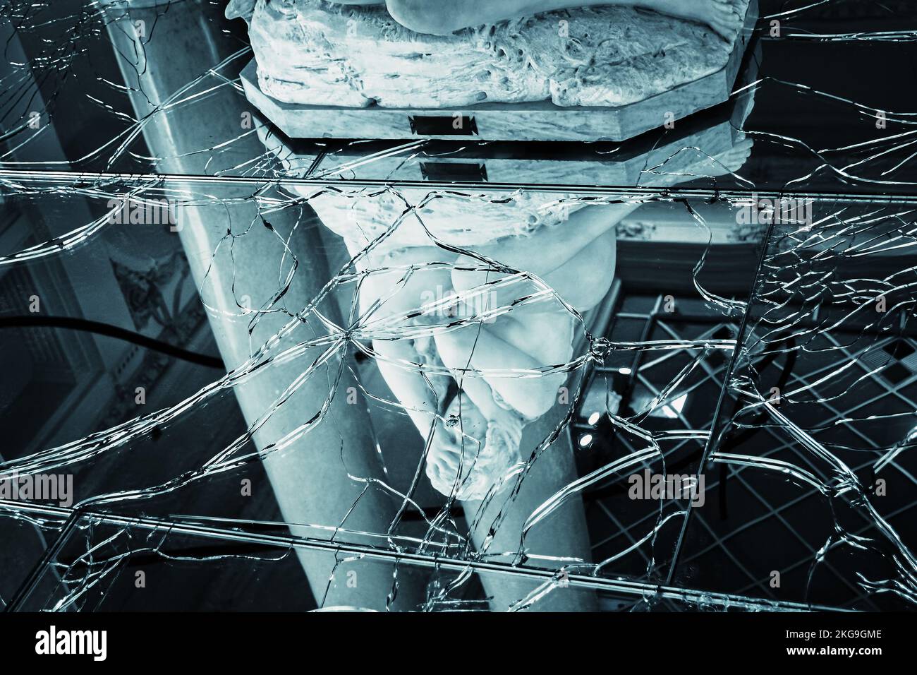 Reflection of a statue in broken glass, horror Stock Photo - Alamy