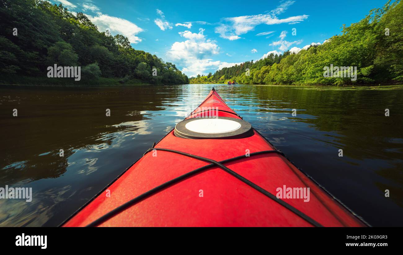 Red tourist kayak on a calm river Stock Photo - Alamy