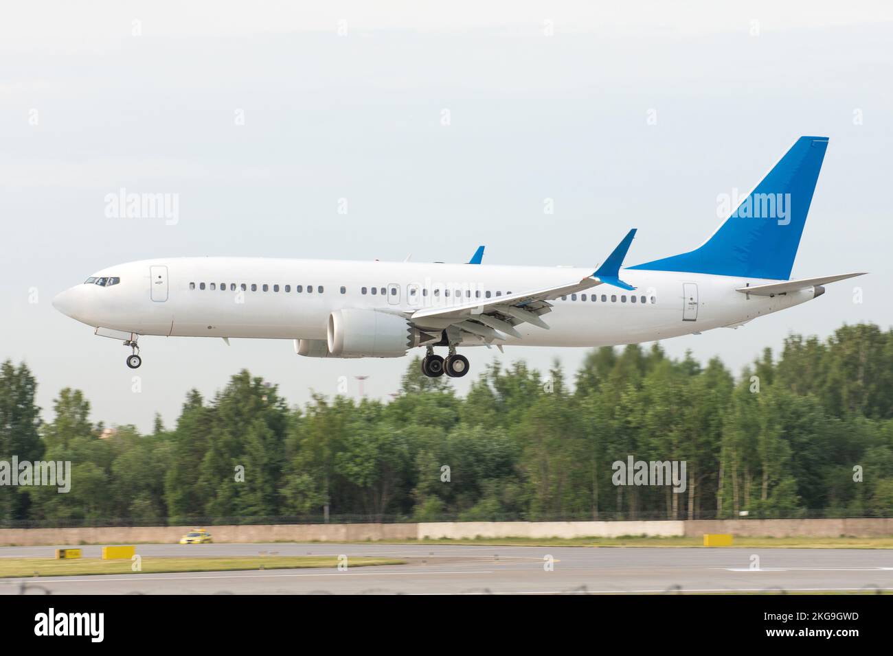 Civil passenger airplane landing runway at international airport Stock ...