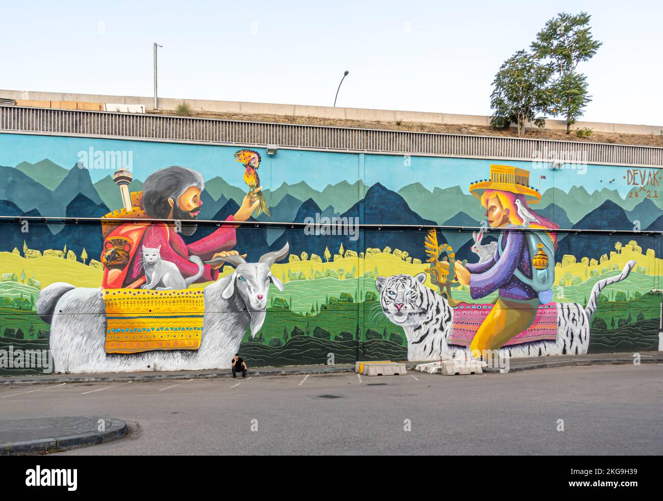 Mural by Devak depicting men riding a tiger and a goat, Turkish history ...