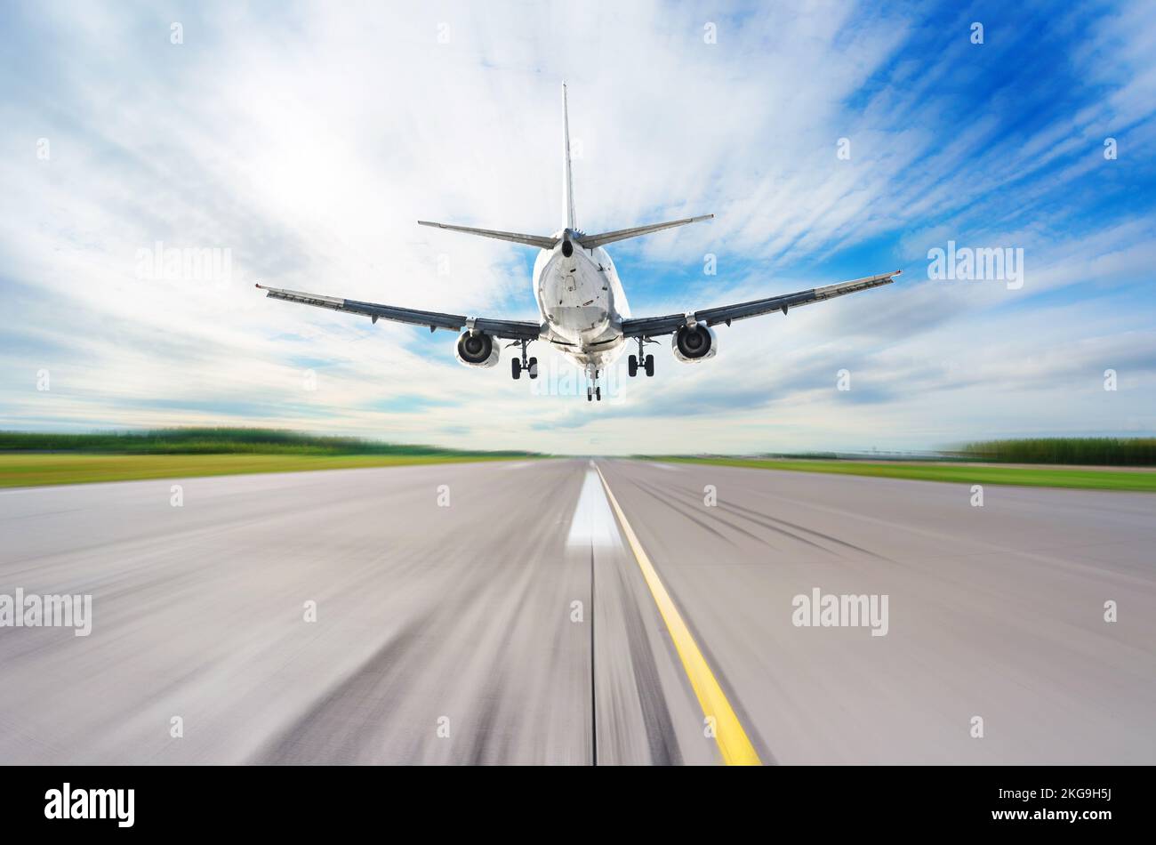 Airliner landed on the runway at the airport, flying overhead at high ...