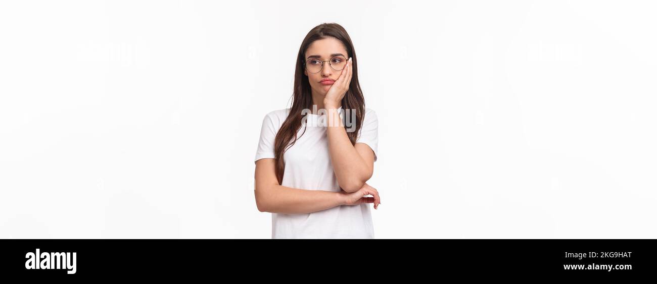 Portrait of bored and uninterested young reluctant girl, listening to ...
