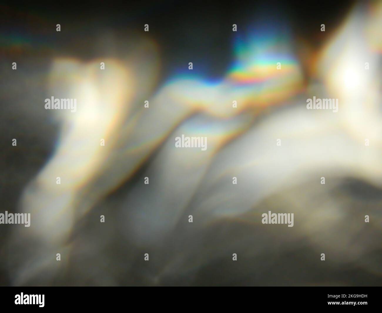 The long exposure view of glowing particles shining in the darkness ...