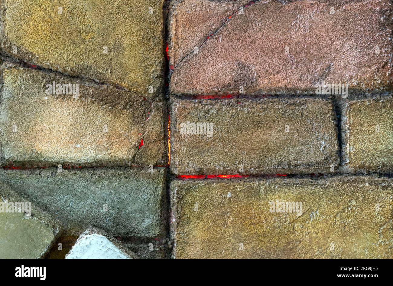 Wall panel made of rough stone with cracks, breaks and internal LED ...