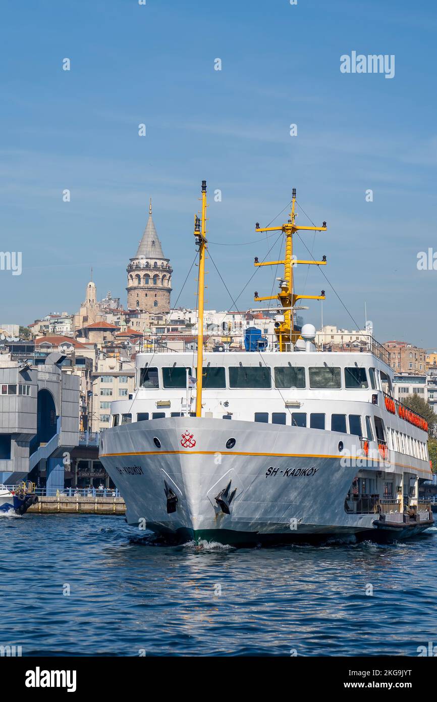 A ship ferry on the Golden Horn in Istanbul with the Galata Tower ...