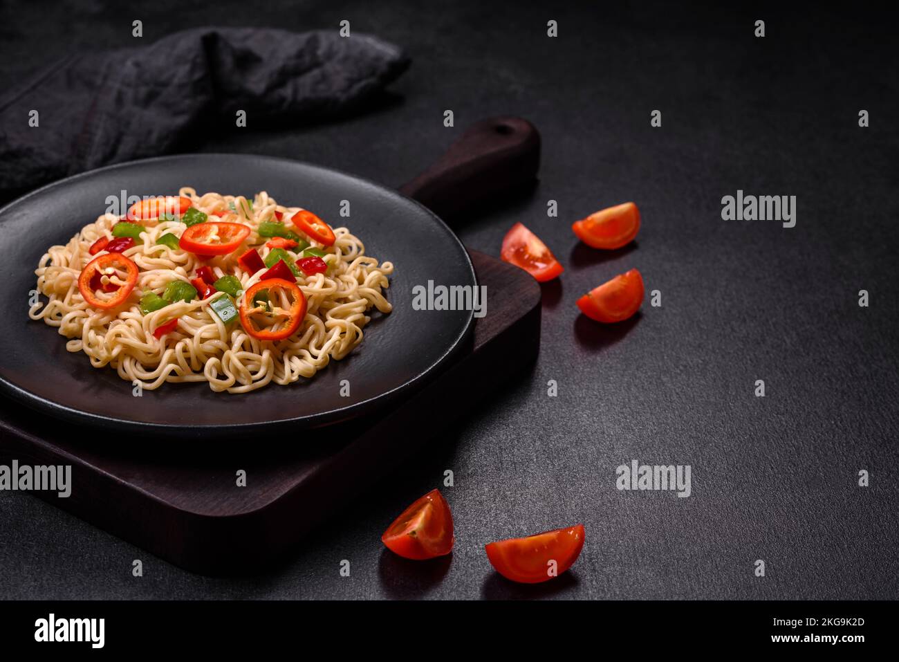 Delicious fresh noodles with sweet pepper, tomato, spices and herbs ...