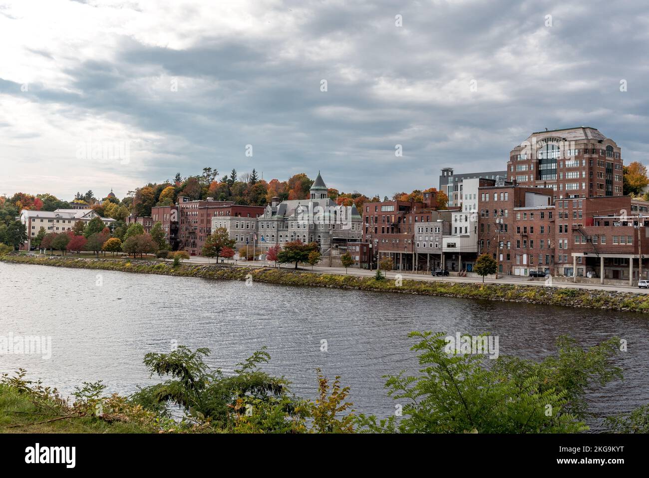 The historic and residential buildings on the bank of a river in ...