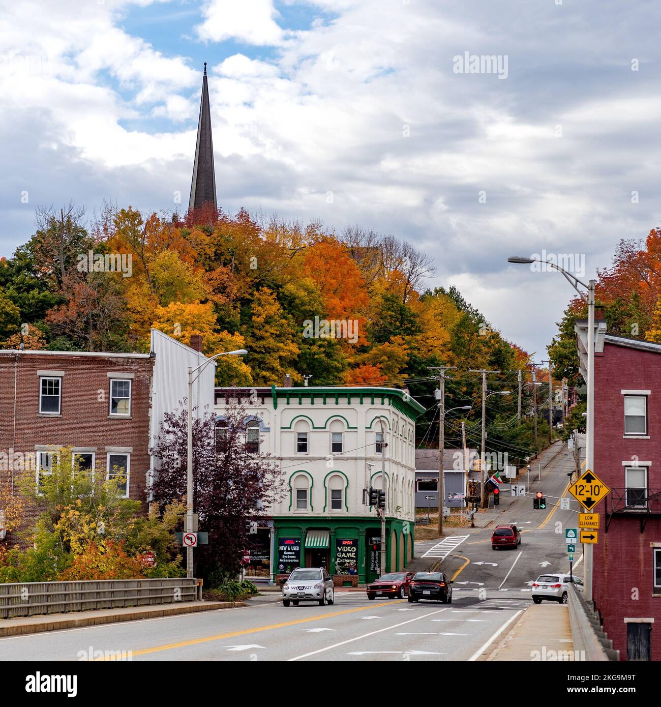 An asphalt road and beautiful buildings in Augusta, Maine with autumn ...