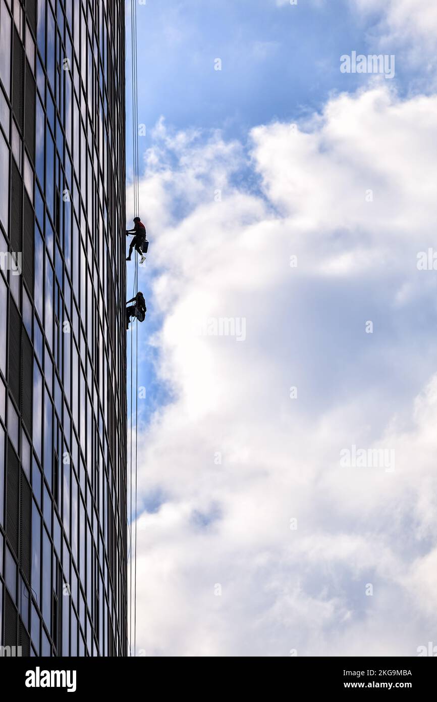 Builders of the tallest building in Kiev on high-altitude works Stock ...