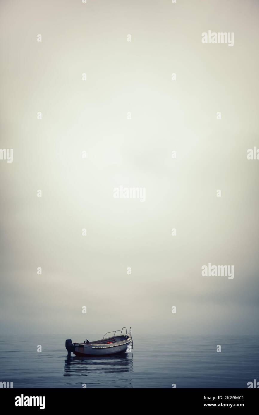 Lonely boat in calm water in the harbor Stock Photo - Alamy