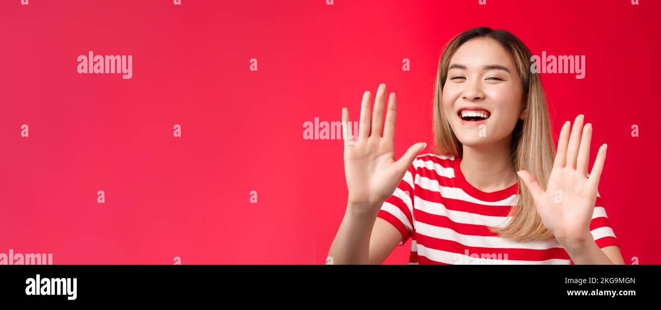 Fine I give up. Emotive happy outgoing young cute asian girl laughing joyfully say ok raise ...