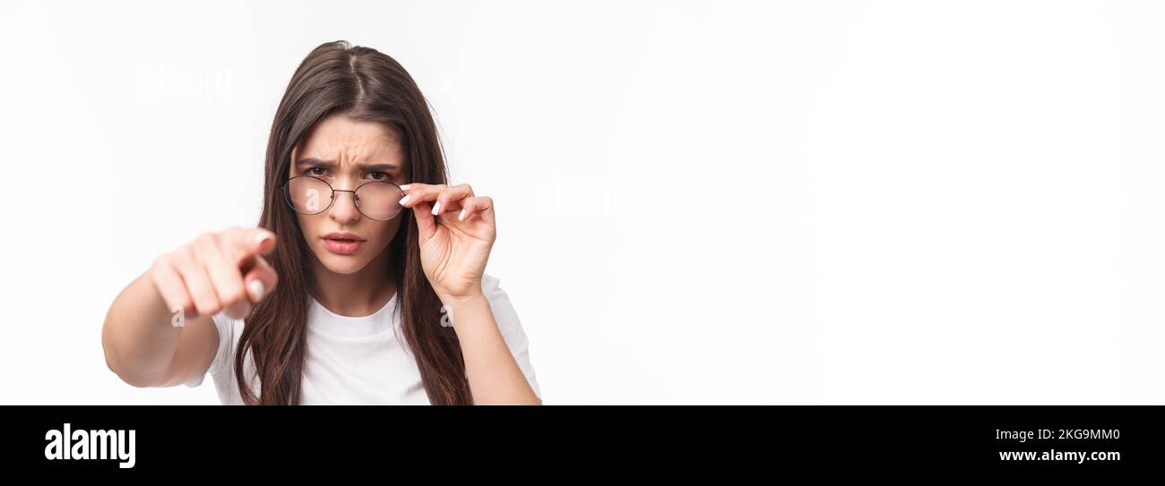 Close-up portrait of suspicious, judgemental woman in glasses, blame ...
