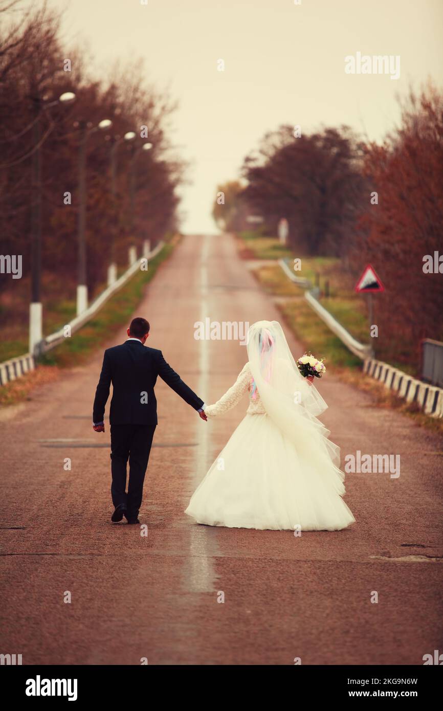 Wedding young couple starts a new path Stock Photo - Alamy