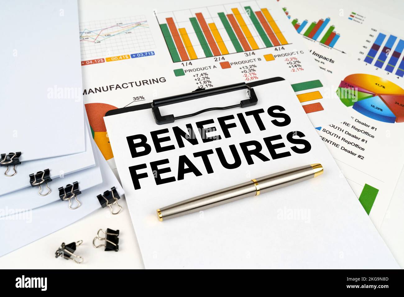 Business concept. On the table among financial graphs and charts lies a ...