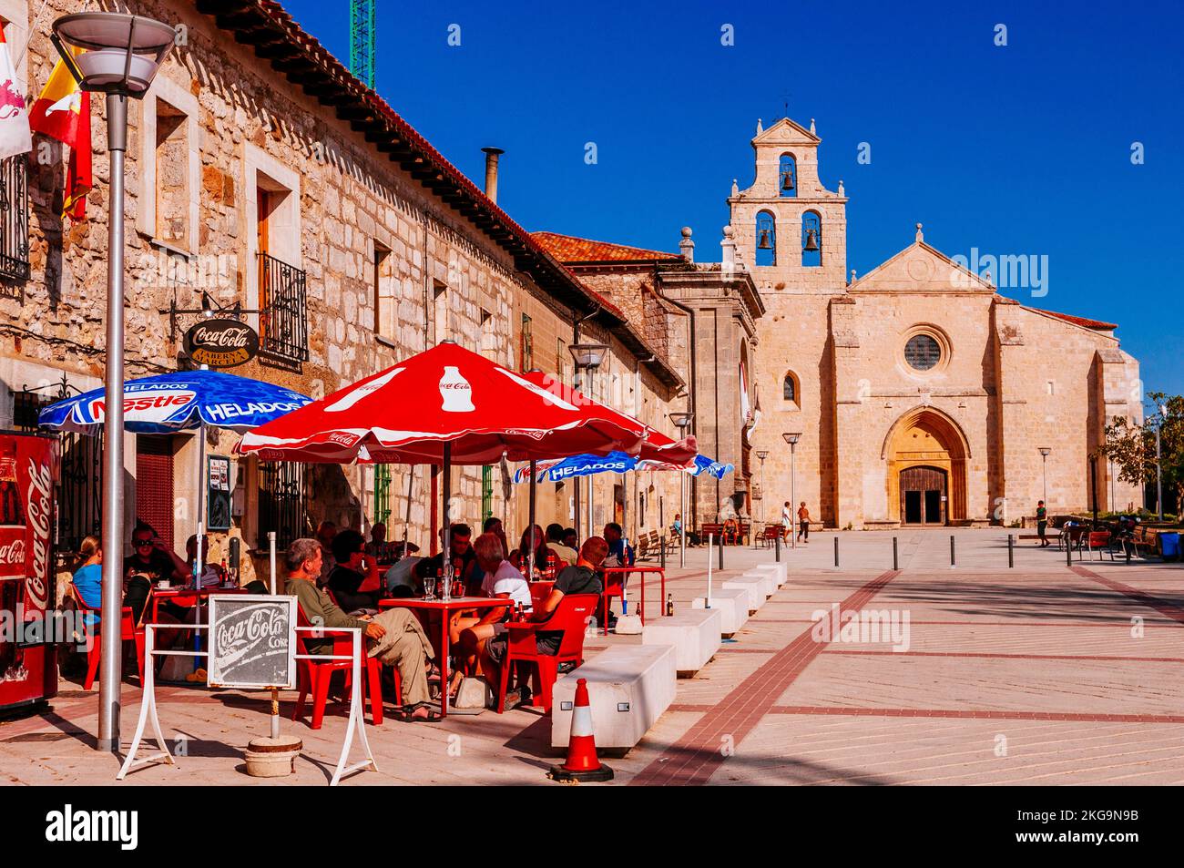 Pilgrims resting on the lively bar terrace. Monastery of San Juan de ...