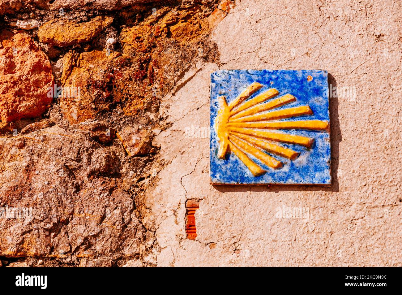 The yellow scallop shell signing the way to Santiago de Compostela. San ...