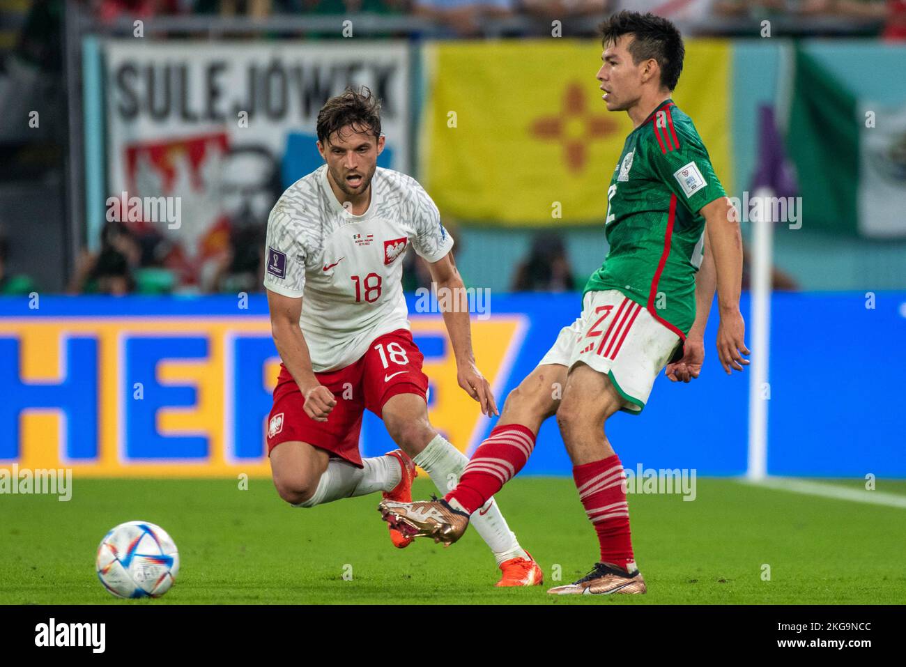 Bartosz Bereszynski of Poland and Hirving Lozano of Mexico during the FIFA World Cup Qatar 2022 ...