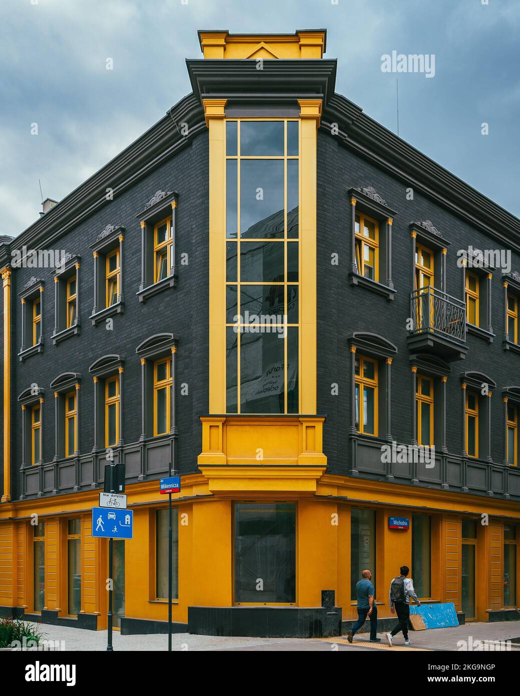 A vertical of a black and yellow tenement in Lodz, Poland Stock Photo ...