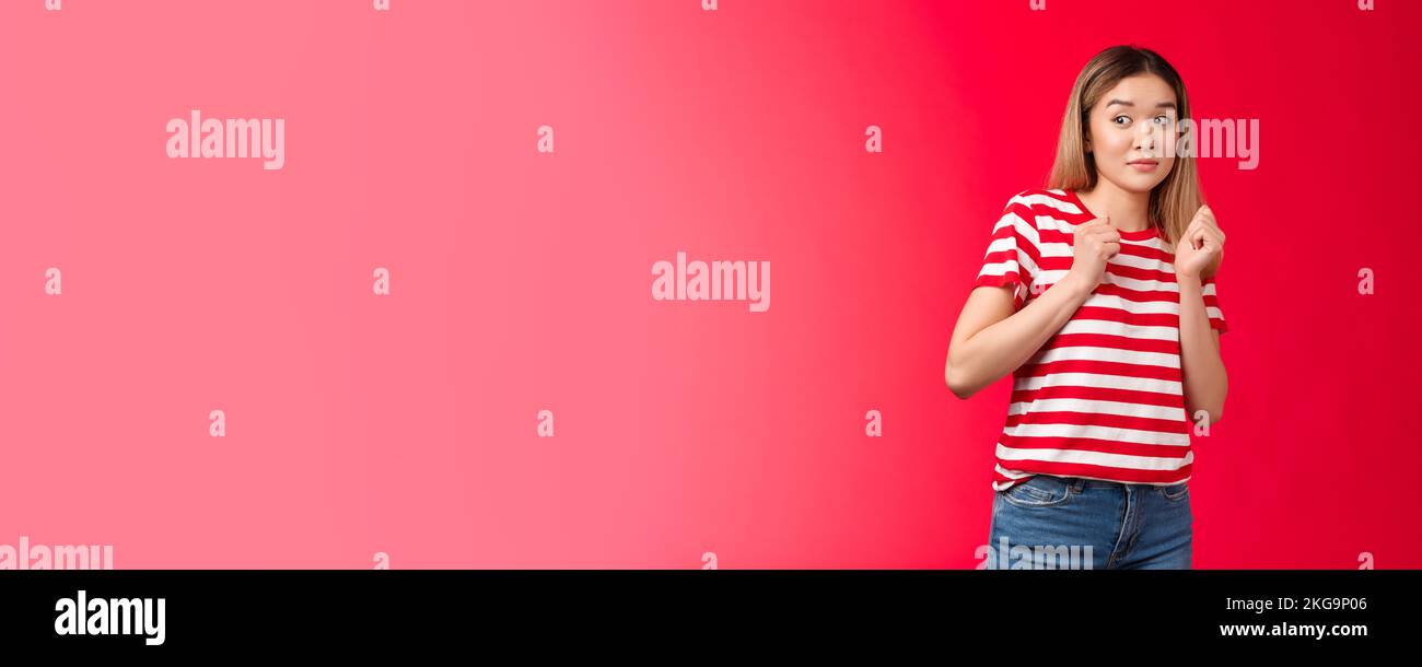 Alarmed silly blond asian girl wear striped t-shirt stay away ...