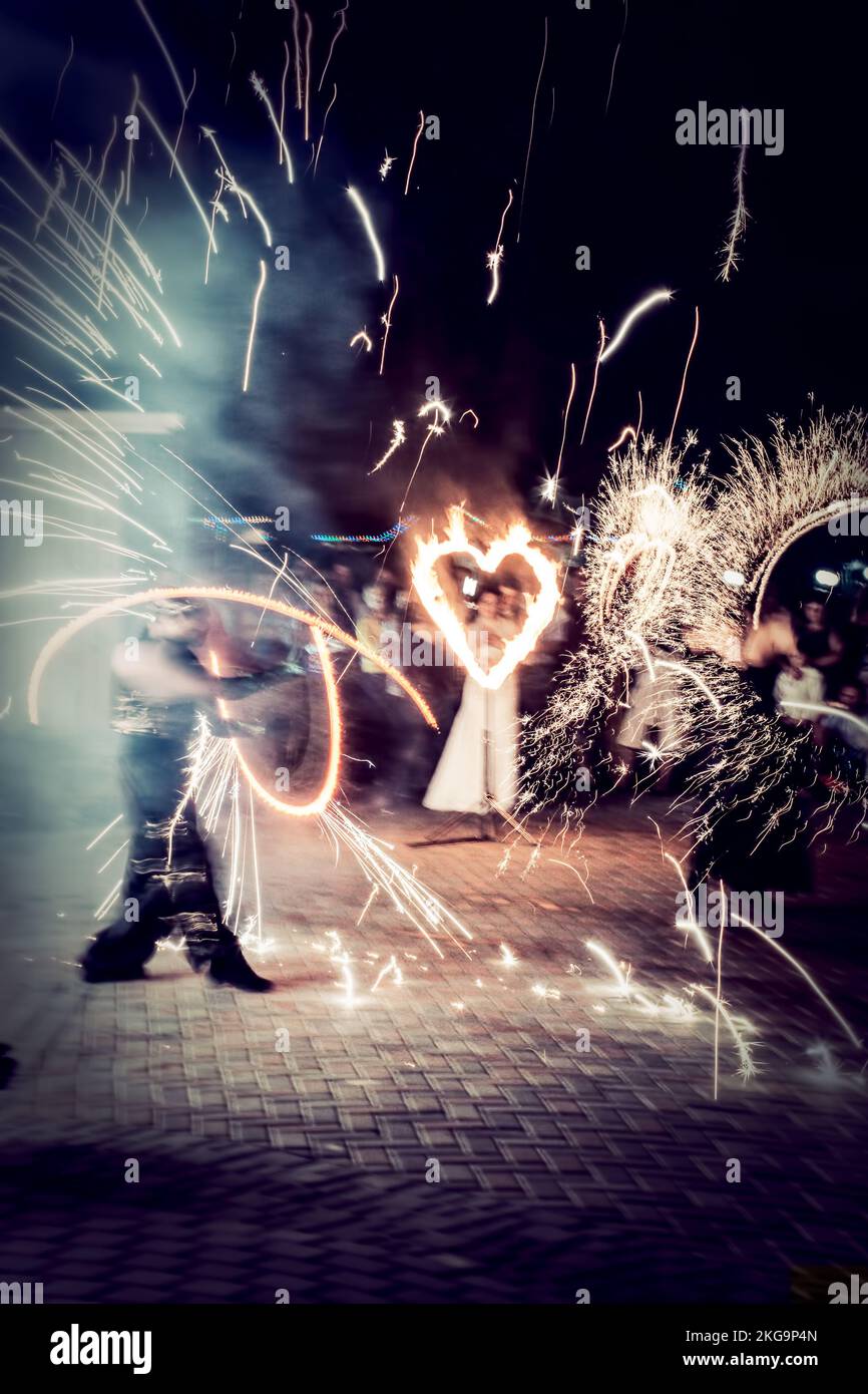 Night fire show at the wedding, night entertainment Stock Photo - Alamy