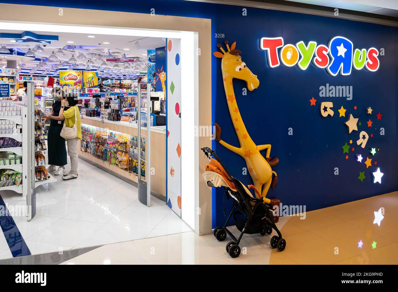 Customers are seen at the American multinational toy chain Toys 'R' Us ...