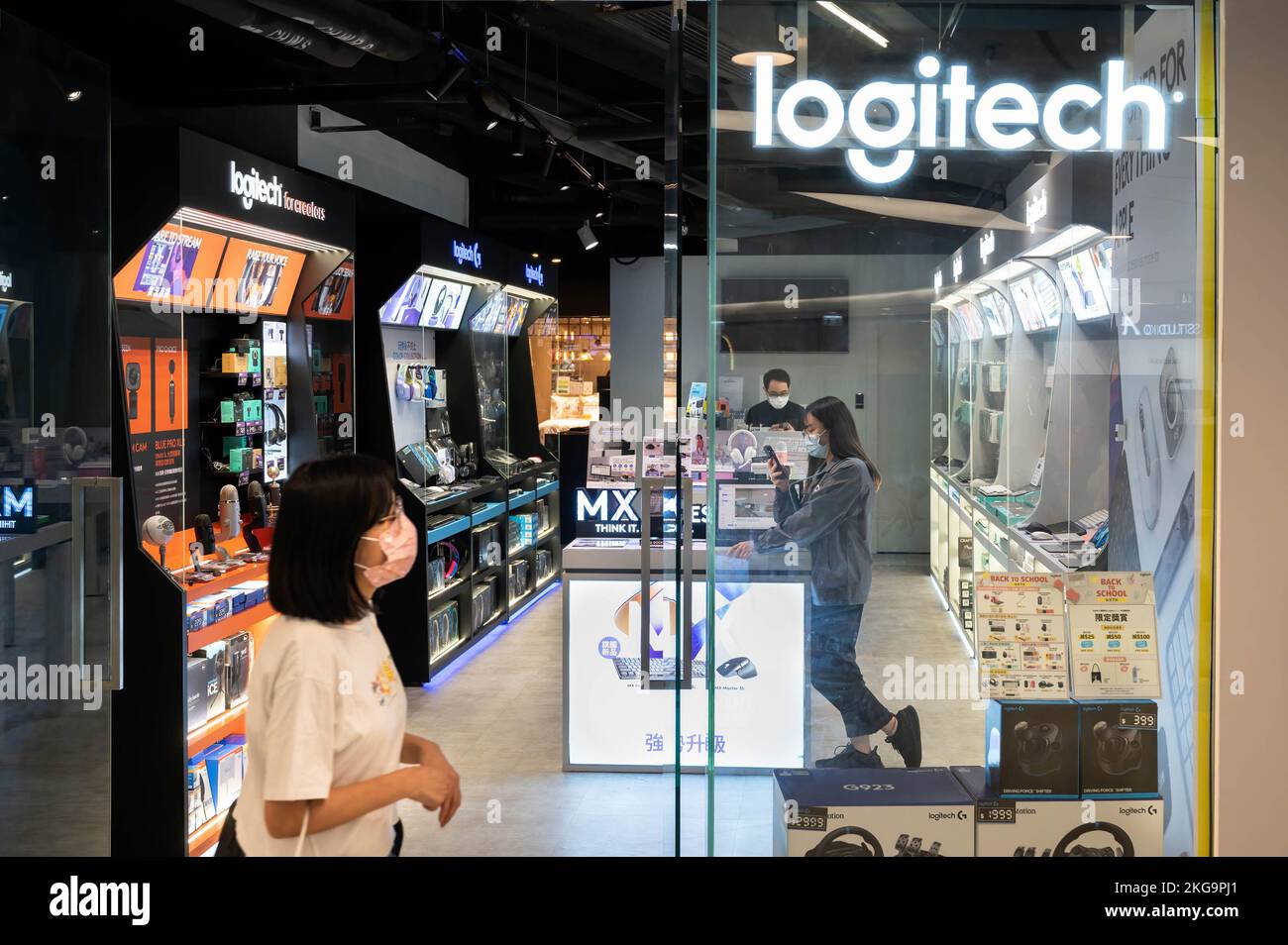 A shopper walks past the Swiss electronics company Logitech store in ...