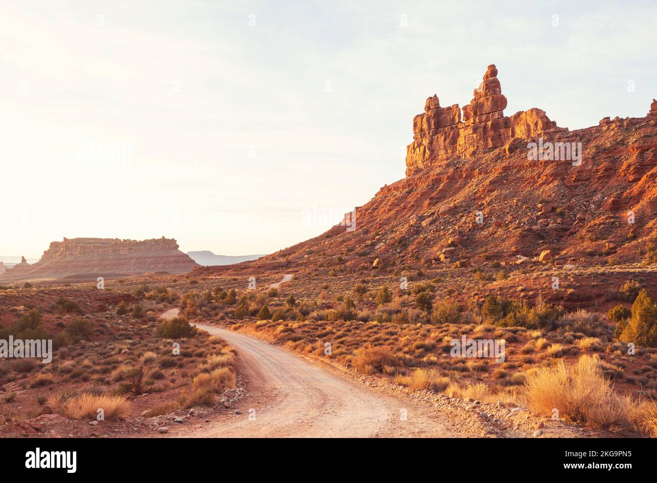 Valley of the Gods rock formation with Monument Valley at sunrise Stock ...
