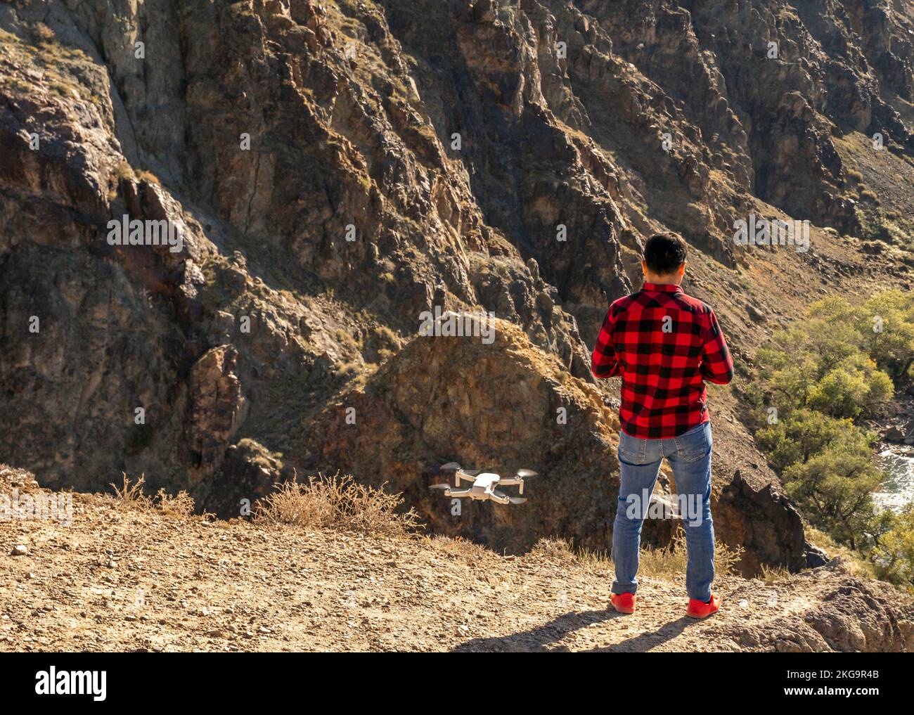 A tourist with a drone in Black canyon, Kazakhstan. Chernyi Kanion ...