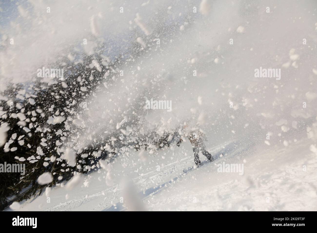 An active snowboarder freeriding on a backcountry terrain leaving a ...