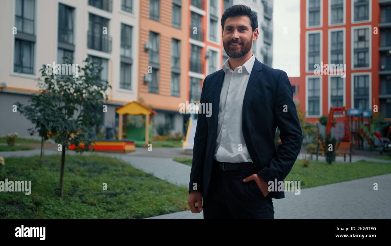 Happy homeowner successful man businessman architect realtor standing ...