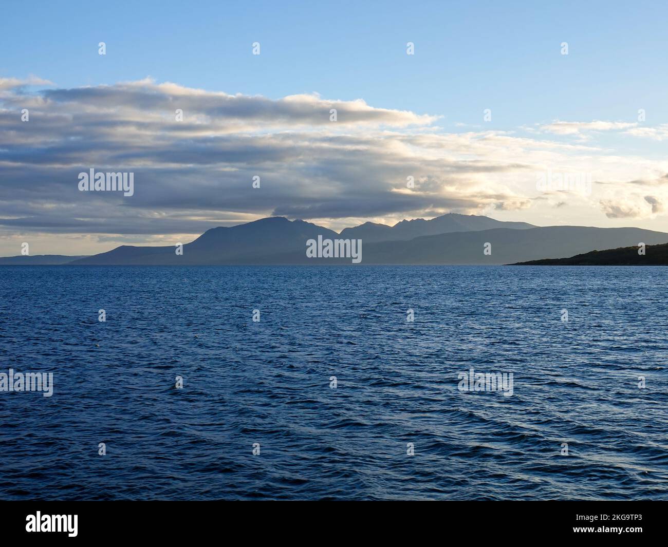 Dusk with clouds, looking across water the Firth of Clyde with ...