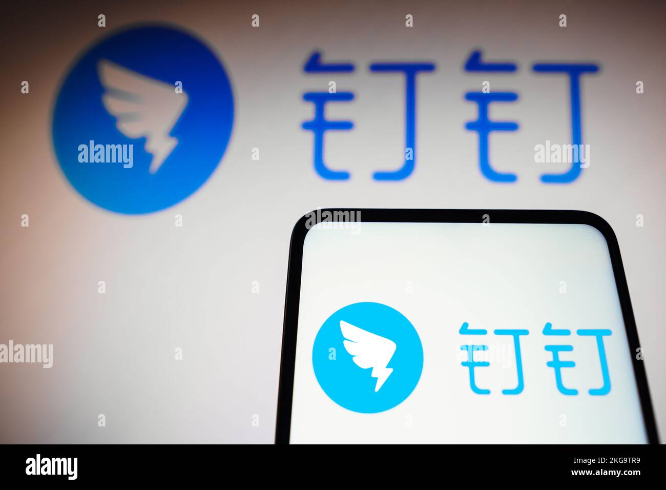 In this photo illustration, the DingTalk logo is displayed on a ...