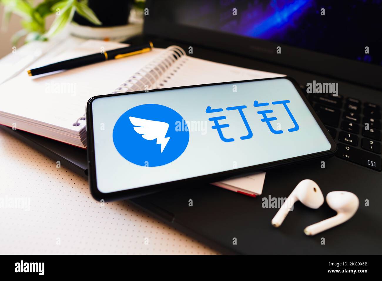 In this photo illustration, the DingTalk logo is displayed on a ...