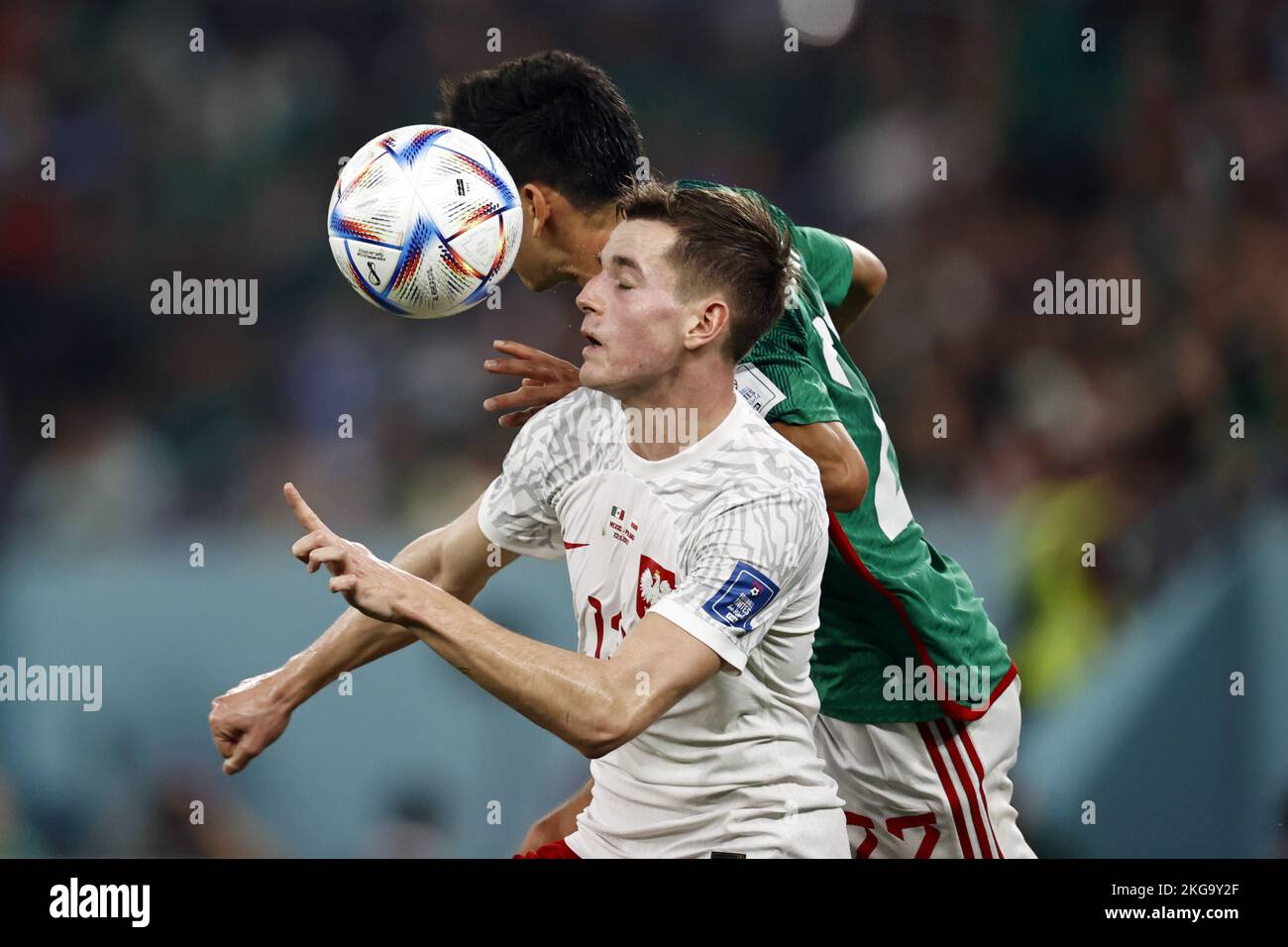 DOHA - Qatar, 22/11/2022, (LR) Jakub Kaminski of Poland, Hirving Lozano ...