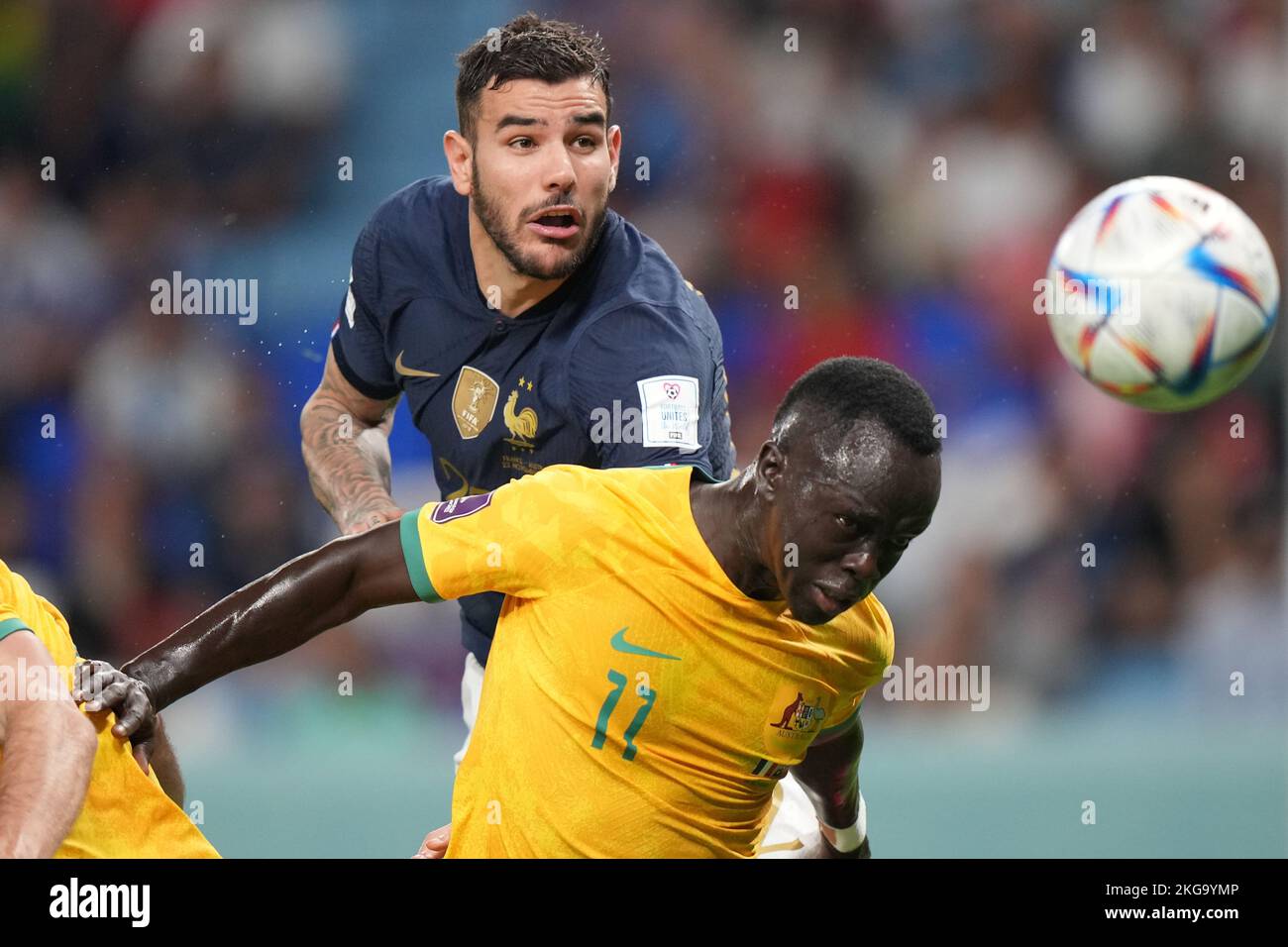 Theo Hernandez of France and Awer Mabil of Australia during the Qatar ...