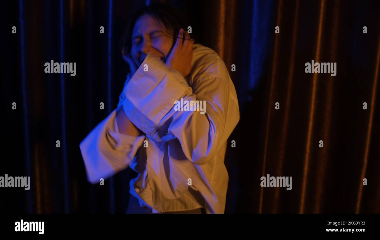 Depressed teenager moving in agony, stressed sad young woman having ...