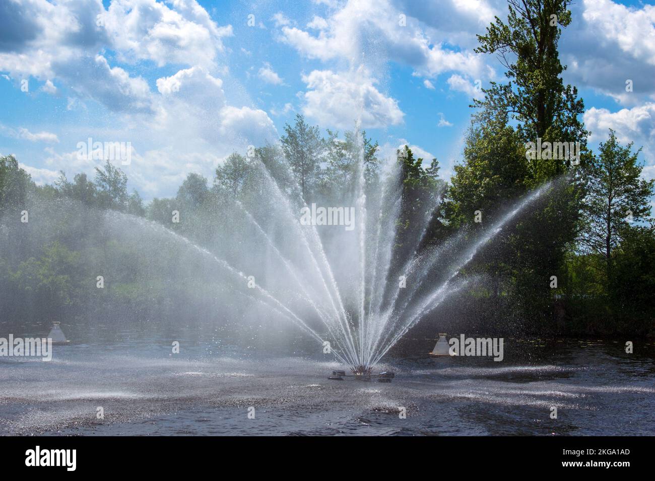 Fountain on the lake in the park. Summer sunny day. Rest zone Stock ...
