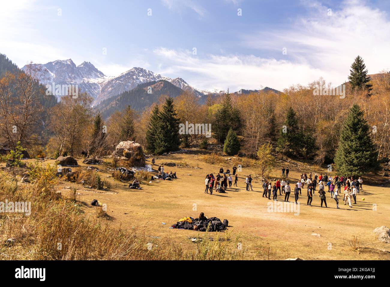 Group of tourists in plateau, valley in Tien-Shan mountains, South ...