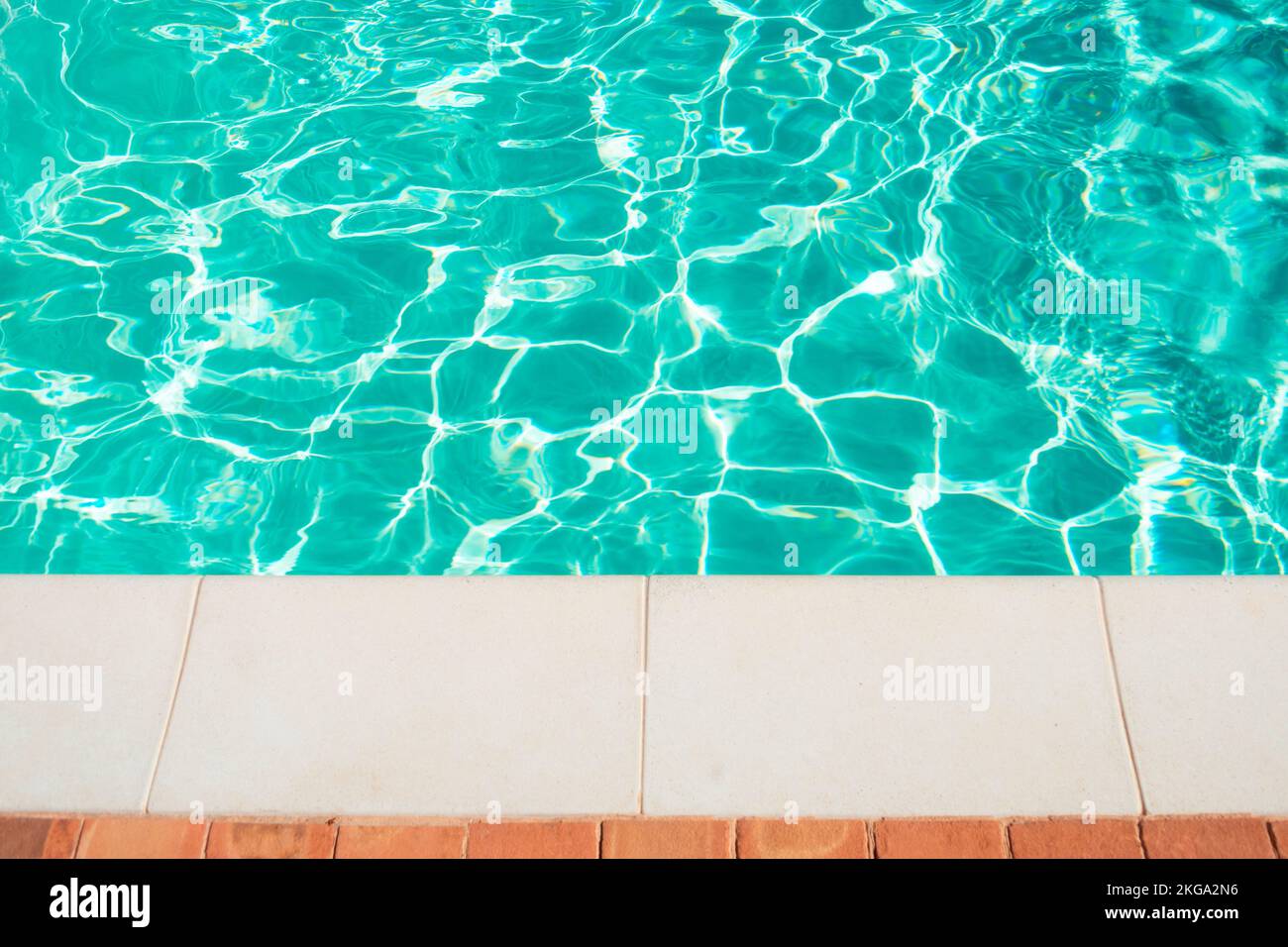 Swimming pool border. Close up edge of white cement floor near swimming ...