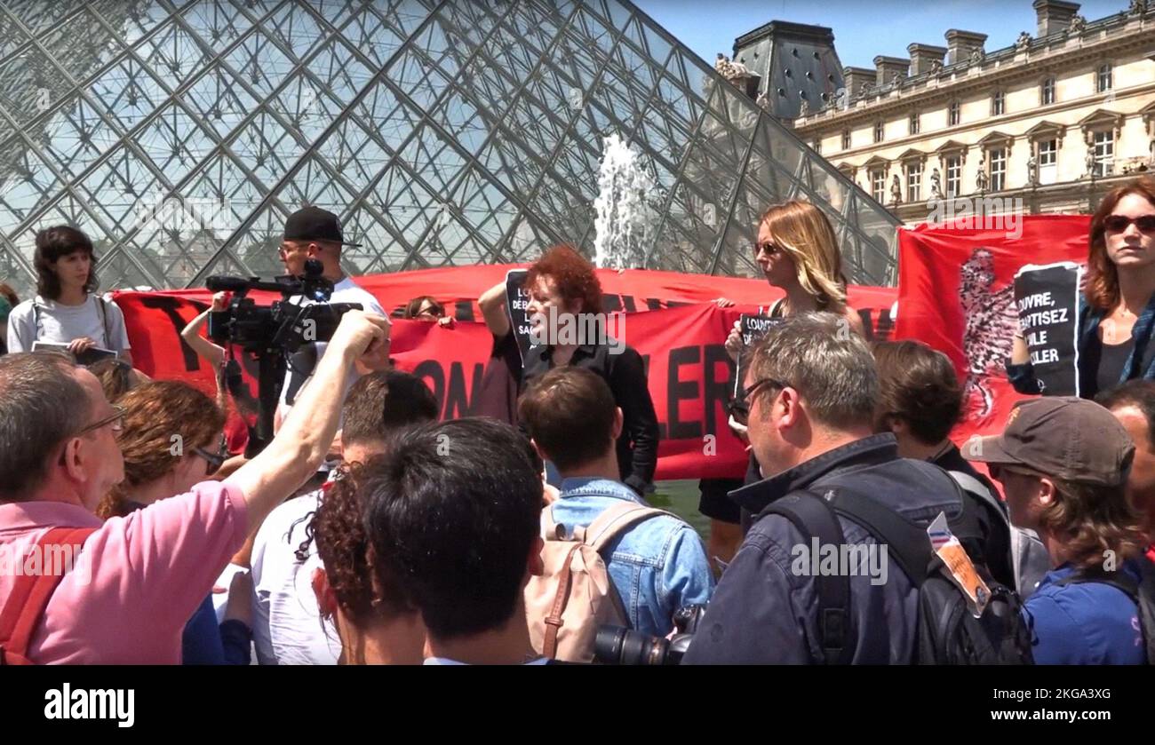 ALL THE BEAUTY AND THE BLOODSHED, Nan Goldin (center) leading protest ...